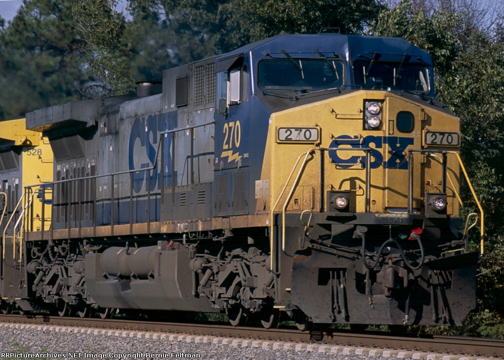 CSX AC44CW #270, with a W081 company ballast train in tow,